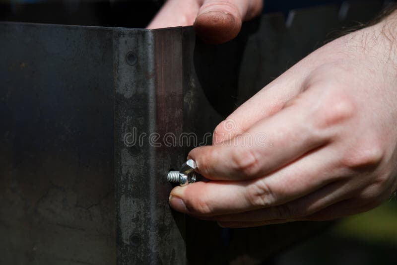 Screwing Up a Nut by Hand. Close Up. Stock Photo - Image of connection ...