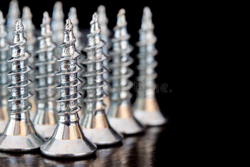 Screws on a Black Background. Advertising Photo Stock Photo - Image of ...