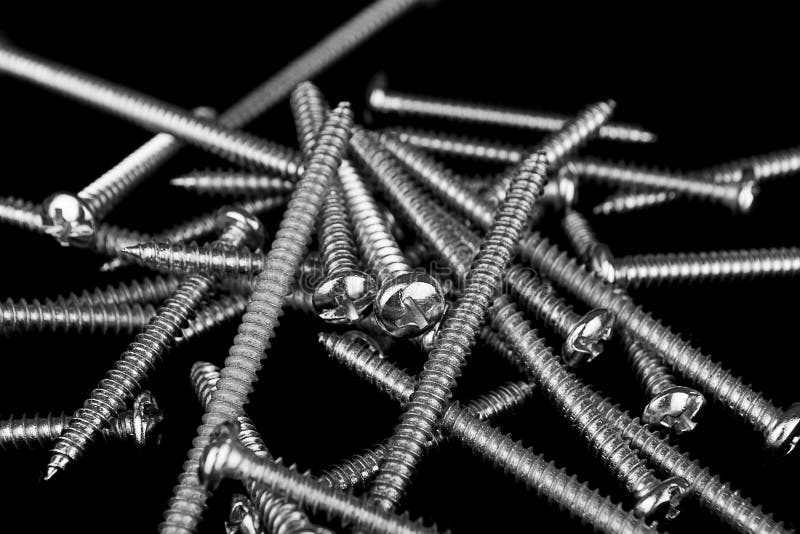 Screws on Black background stock photo. Image of consumable - 32792052