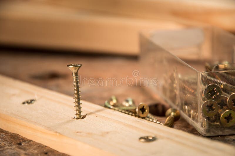 Screws in a Board stock image. Image of retro, detail - 26308013
