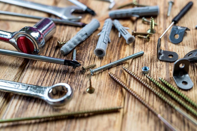Screws and Dowels for Hanging Objects Shown on Isolated Wood Background ...