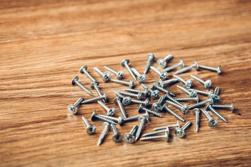 Screws Fasteners Hardware on Wooden Background Stock Image - Image of ...