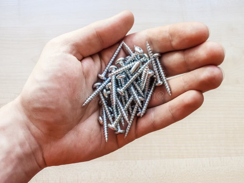 Screws on the table stock image. Image of material, detail - 53868307