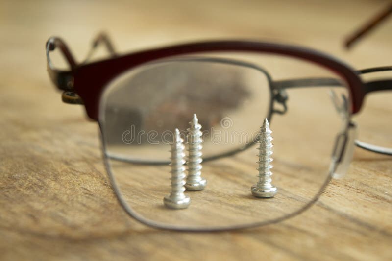 Screws Seen through Eyeglass Stock Image - Image of glasses, screws ...