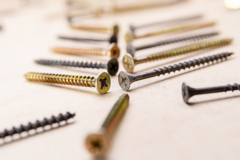 Self-tapping Screws on a Wooden Background Stock Image - Image of ...