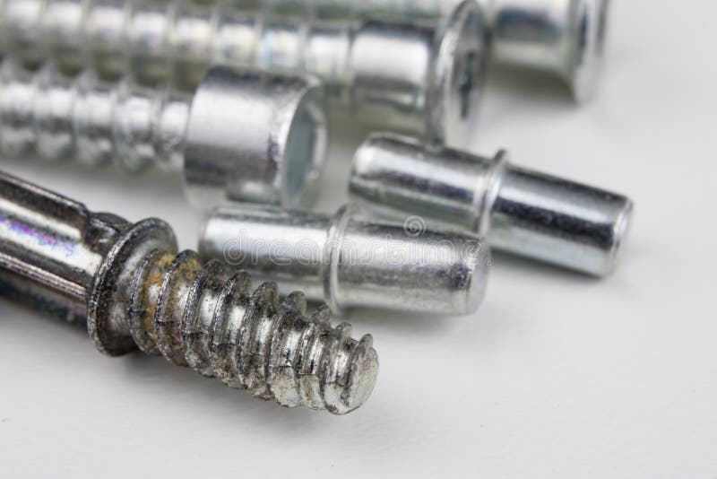 Screws on a White Table. Accessories for Connections Stock Photo ...