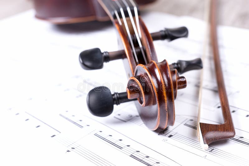 Scroll of the Classical Violin on Music Notes Stock Photo - Image of ...