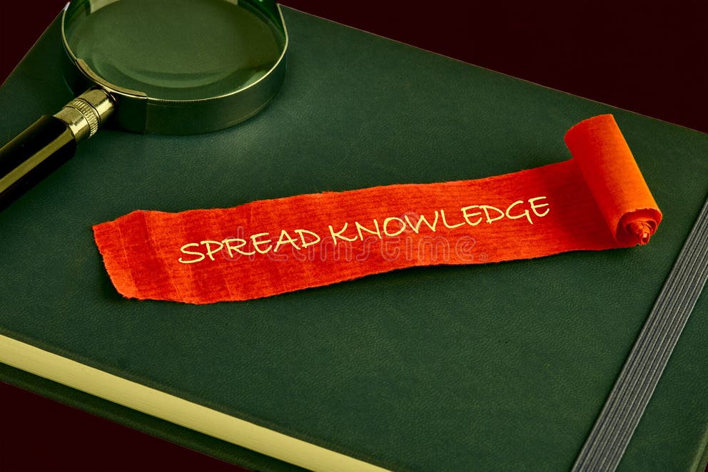 A Scroll with the Words Spread Knowledge Rests on a Dark Surface, Symbolizing the Importance of ...