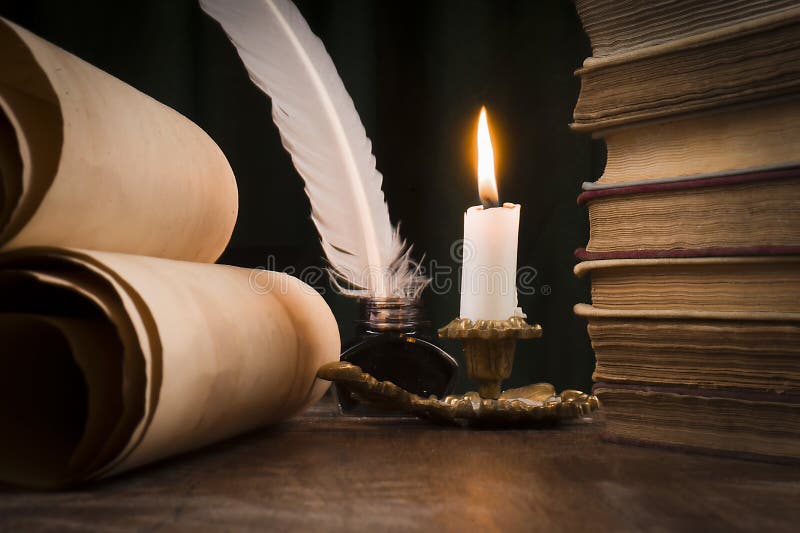 Scrolls of Parchment, a Stack of Books, and a Lit Candle Stock Photo ...