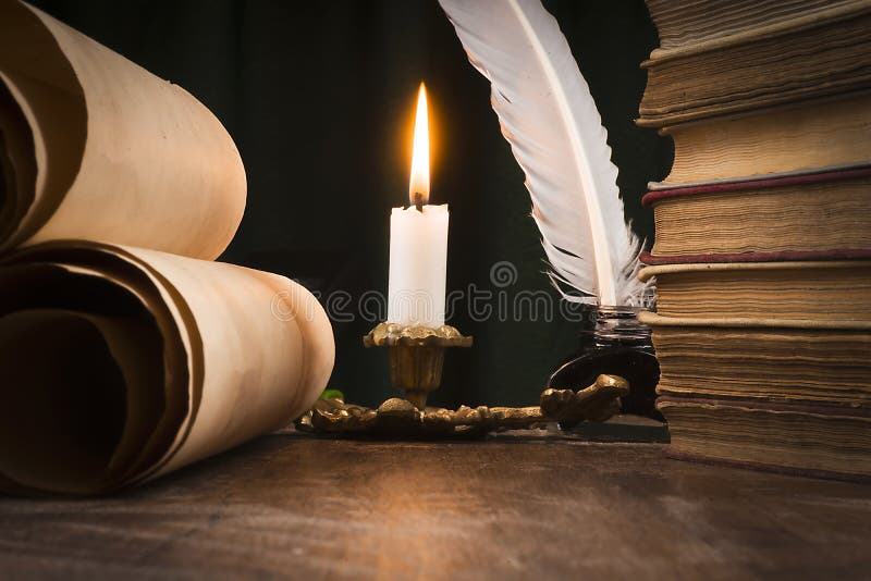 Scrolls of Parchment, a Stack of Books, and a Lit Candle Stock Photo ...