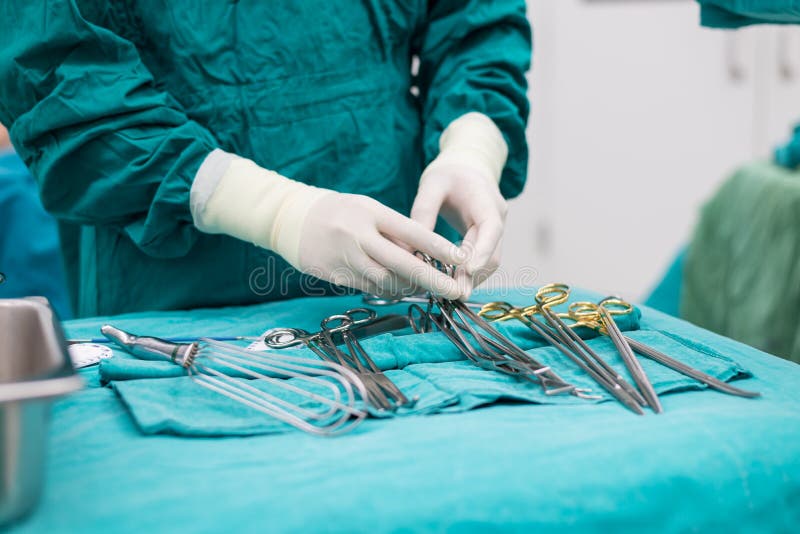 Scrub Nurse Assisting Surgeon with Gown Stock Image - Image of ...