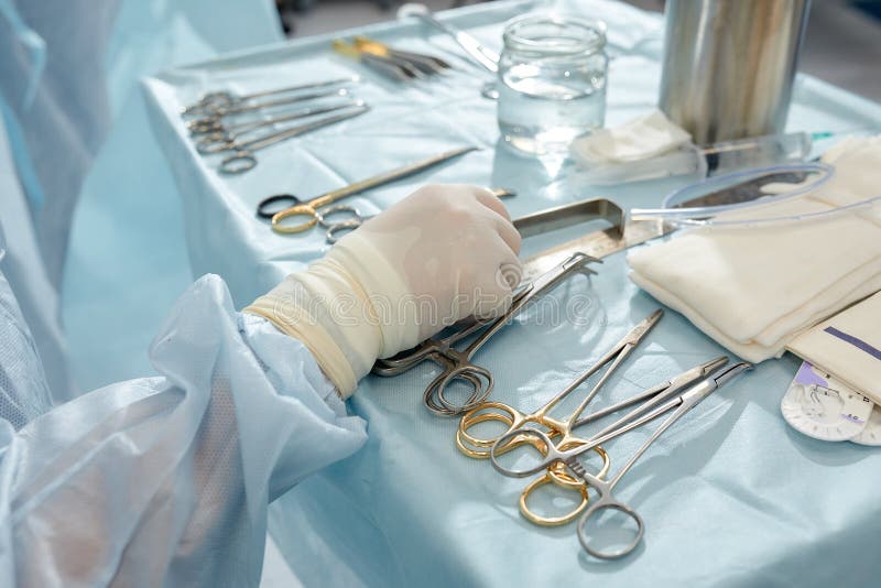 Scrub Nurse Preparing Medical Instruments for Operation Stock Photo ...