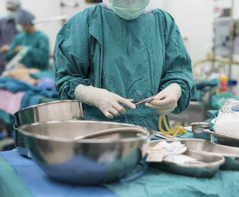 Scrub Nurse Preparing Medical Instruments for Operation Stock Photo ...