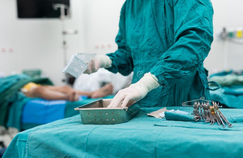 Scrub Nurse Preparing Medical Instruments for Operation Stock Photo ...