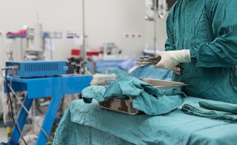 Scrub Nurse Preparing Medical Instruments for Surgery Stock Image ...