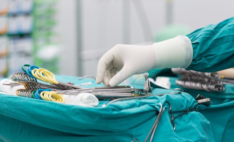 Scrub Nurse Preparing Tools for Operation Stock Photo - Image of ...