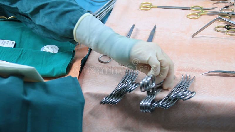 Scrub Nurse Preparing Surgical Instruments for Operation. Stock Video ...