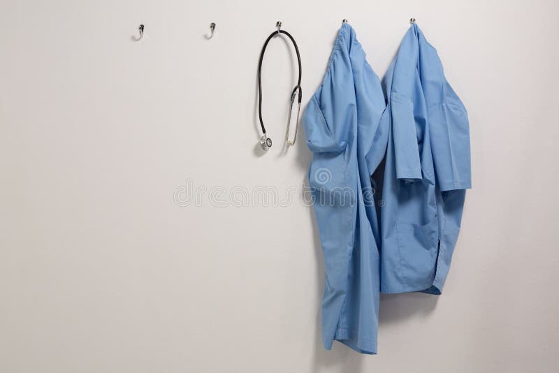 Scrubs and Stethoscope Hanging on Hook Stock Image - Image of hanging ...