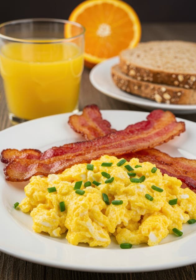 Scrumptious Breakfast: Scrambled Eggs with Crispy Bacon, Orange Juice ...