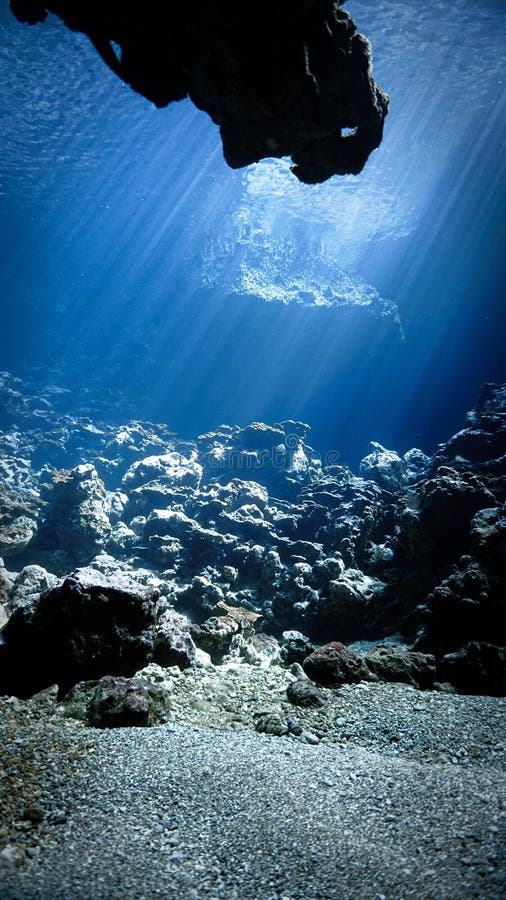 Underwater Photo of Rays of Sunlight Inside a Cave. Stock Photo - Image ...