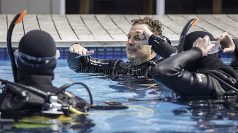 Scuba Dive Instructor Teaching and Explaining To Students Clearing Your ...