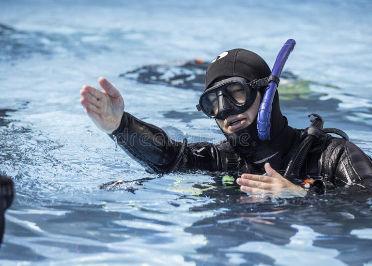 Scuba Dive Instructor Teaching and Explaining To Students the Regulator ...