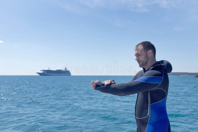 Scuba Diver on Boat, Putting on His Wetsuit. Stock Photo - Image of ...