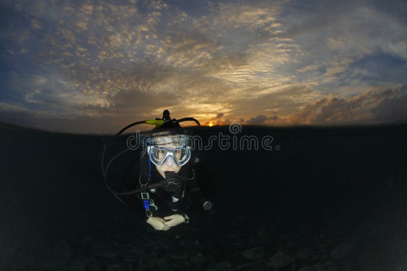 Scuba Diver in Water before a Sunrise Dive Stock Image - Image of ...