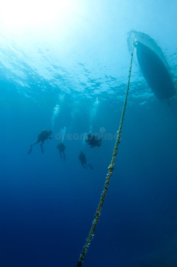 Scuba Divers Dive Together with Boat in Frame Stock Image - Image of ...