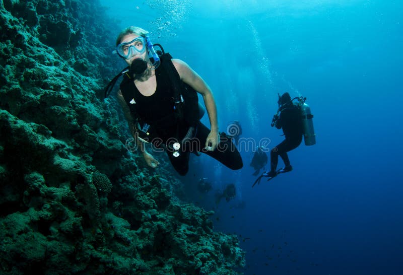 Scuba Divers Swim in the Blue Hole,Dahab Stock Photo - Image of diver ...
