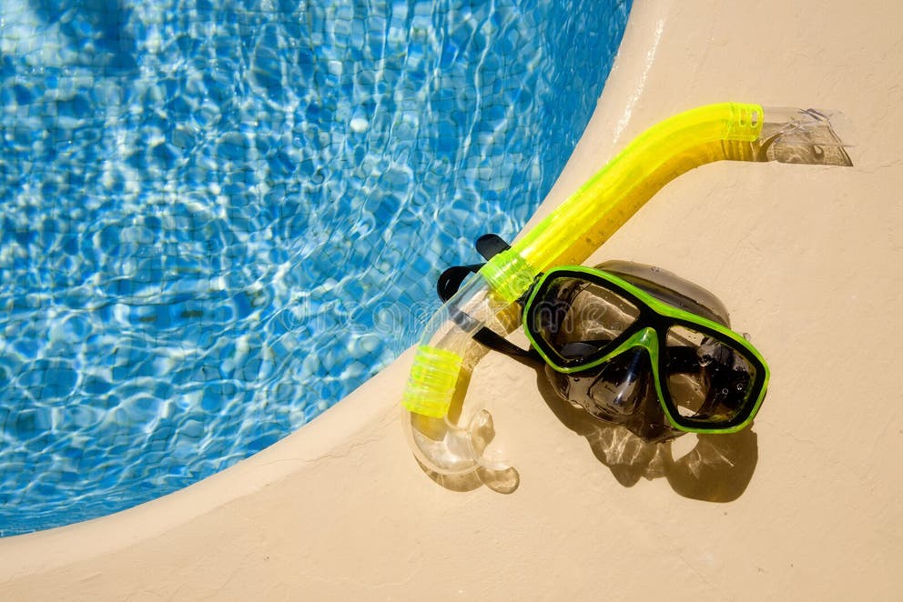 Scuba mask at the poolside stock photo. Image of green - 3540996
