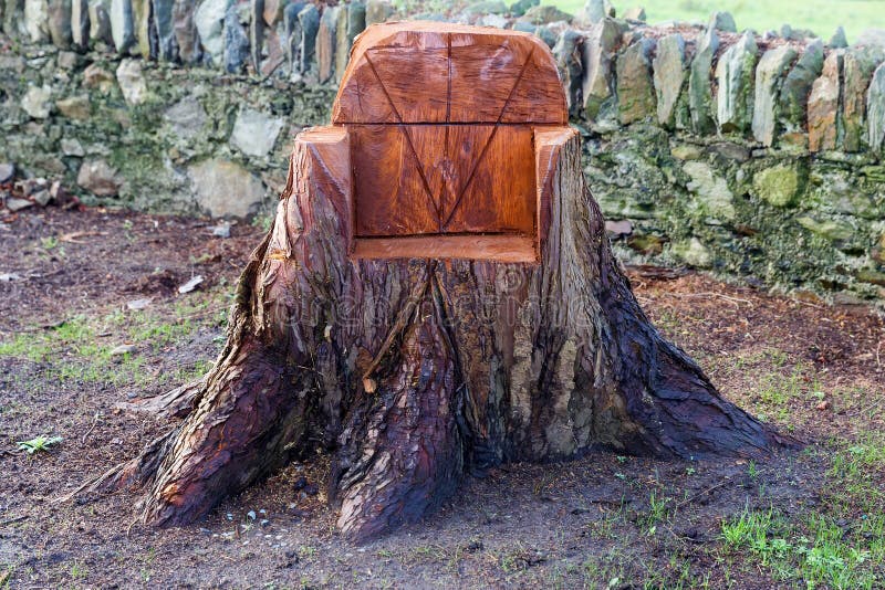 Sculpted Chair from a Tree Trunk Stock Photo - Image of public ...