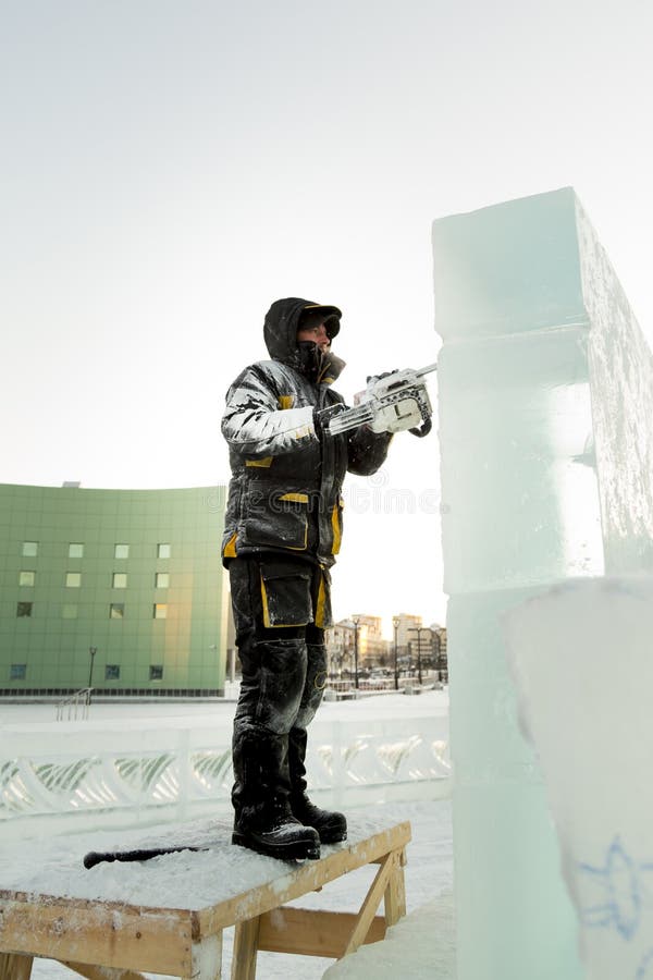 The Wizard Cuts Figures from the Ice Chainsaw Stock Photo - Image of ...