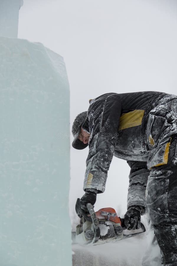 The Wizard Cuts Figures from the Ice Chainsaw Stock Photo - Image of ...
