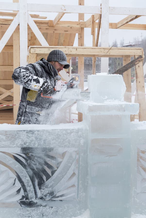The Wizard Cuts Figures from the Ice Chainsaw Stock Image - Image of ...