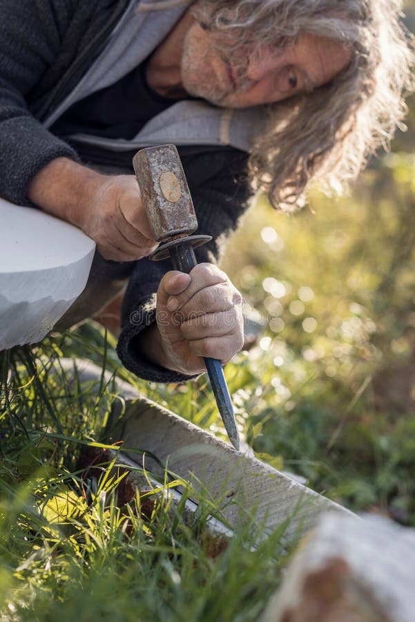 Chisel and hammer in hand stock photo. Image of lathe - 10418792