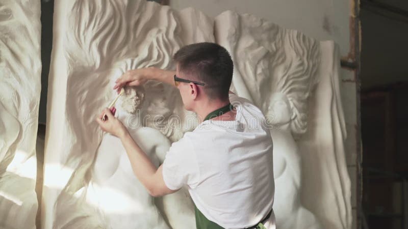 Sculptor Work with Plaster Structural Composition on the Wall of Women ...