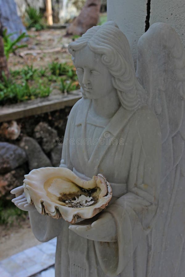Sculpture of an Angel with a Sea Shell . Philippines Stock Image ...