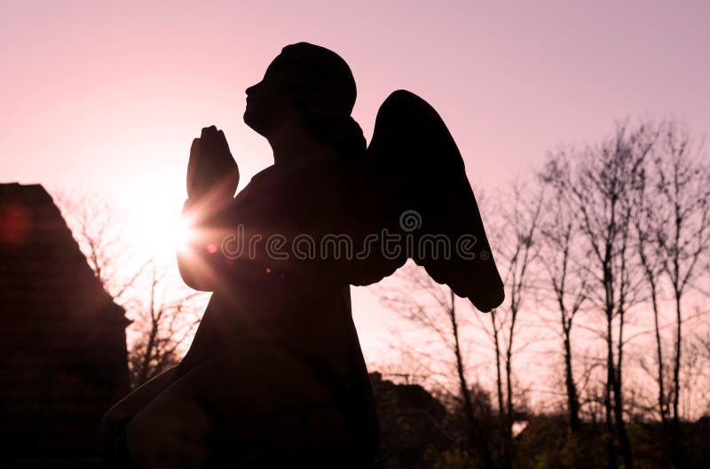 Sculpture of an Angel in the Sunset Stock Photo - Image of light ...
