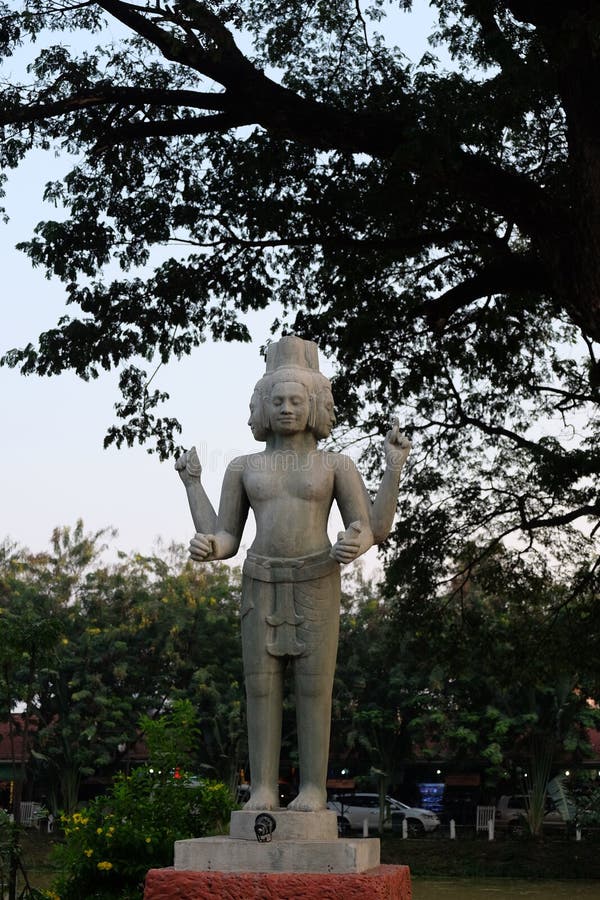 Sculpture of a Four-armed Hindu Deity. Mythical Creature with Four ...