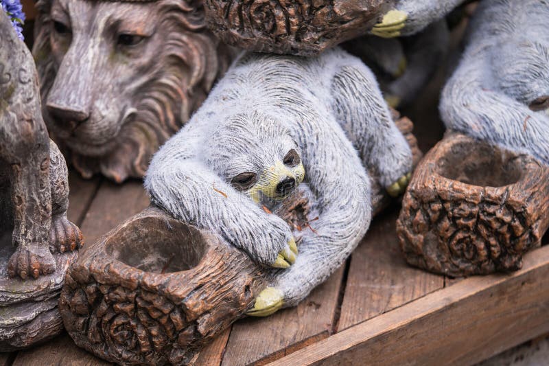Sculpture of a Sloth Laying on the Tree Stock Photo - Image of adorable ...