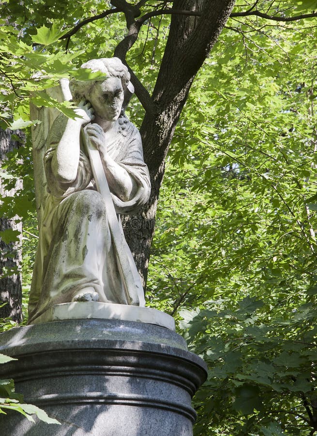 Grieving Angel Statue on a Family Grave Stock Photo - Image of grief ...
