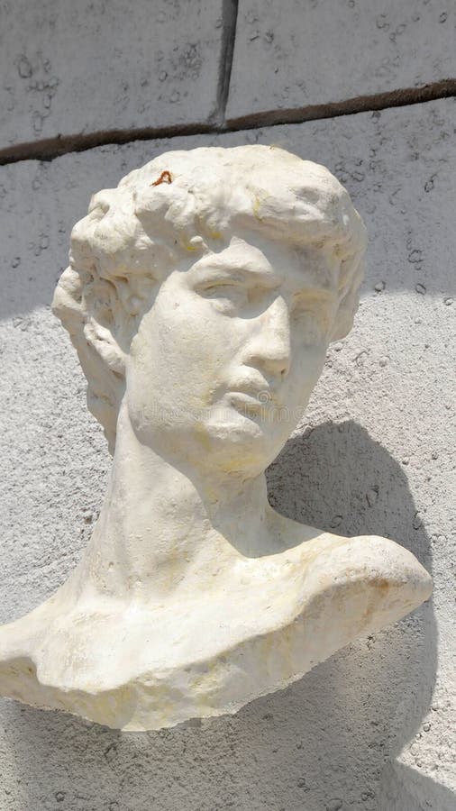 A Sculpture of a Mans Head Displayed Against a White Wall Stock Image ...