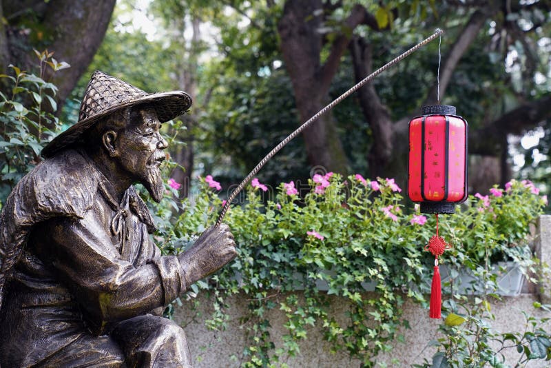 Sculpture of an Old Man with a Chinese Lantern Stock Image - Image of ...
