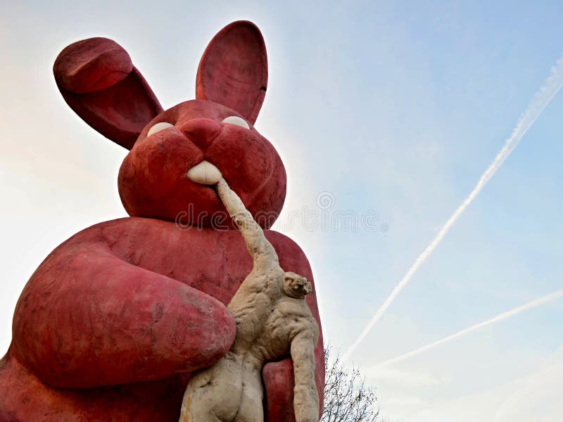Sculpture of Rabbit Eating a Man Stock Photo - Image of sculpture ...