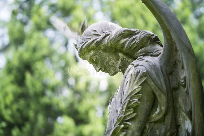 Sculpture of a sad angel. stock photo. Image of blurred - 103187050