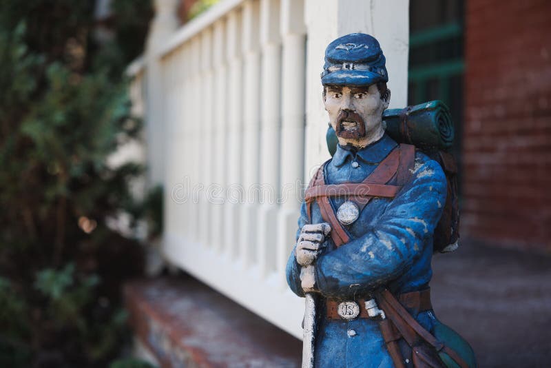 A Statue in the Shape of a Soldier is Sitting Outside Stock Photo ...
