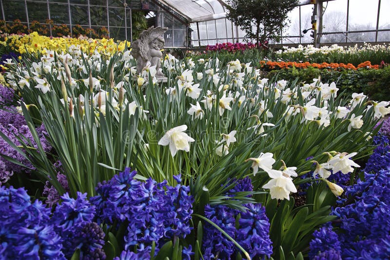 A Sculpture Surrounded by the Spring Flowers Inside a Conservatory ...