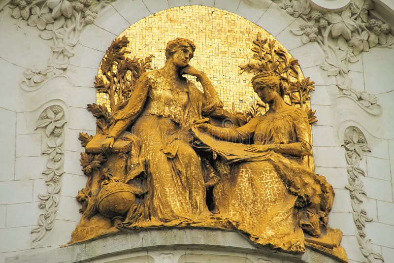 Sculpture of Two Women in Gold on the Building Stock Photo - Image of ...