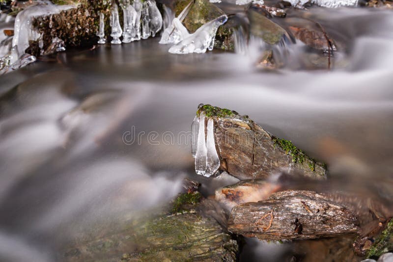 Sculptures of Ice Hanging Over a Waterfall Stock Image - Image of ...